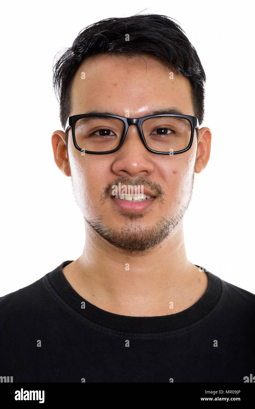 Face of young happy Asian man smiling and wearing eyeglasses Stock ...