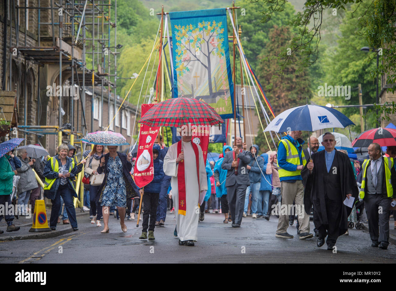Delph, UK. 25th May 2018. Ministers head the procession along the High ...