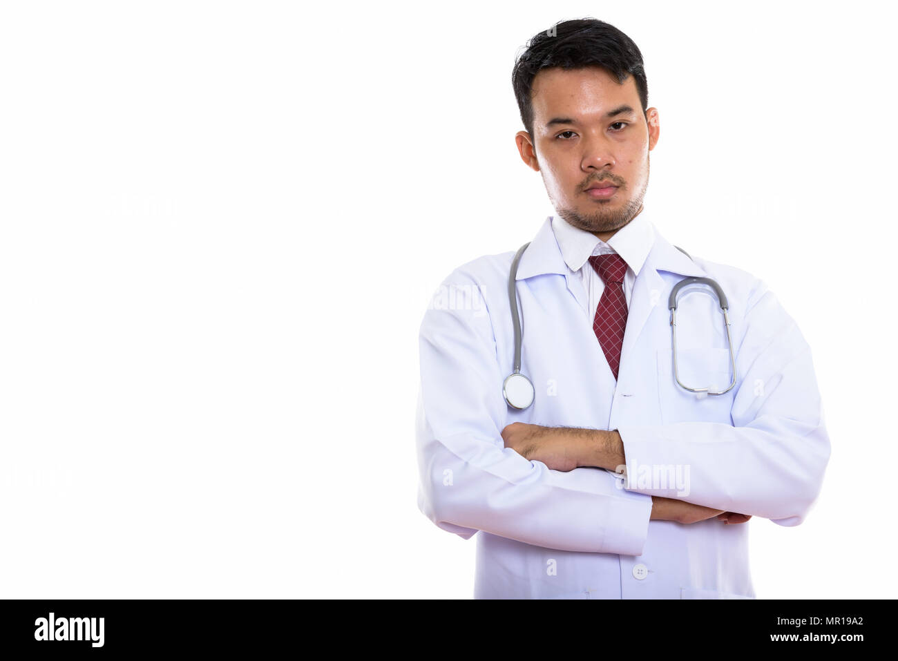 Young doctor arms crossed hi-res stock photography and images - Alamy