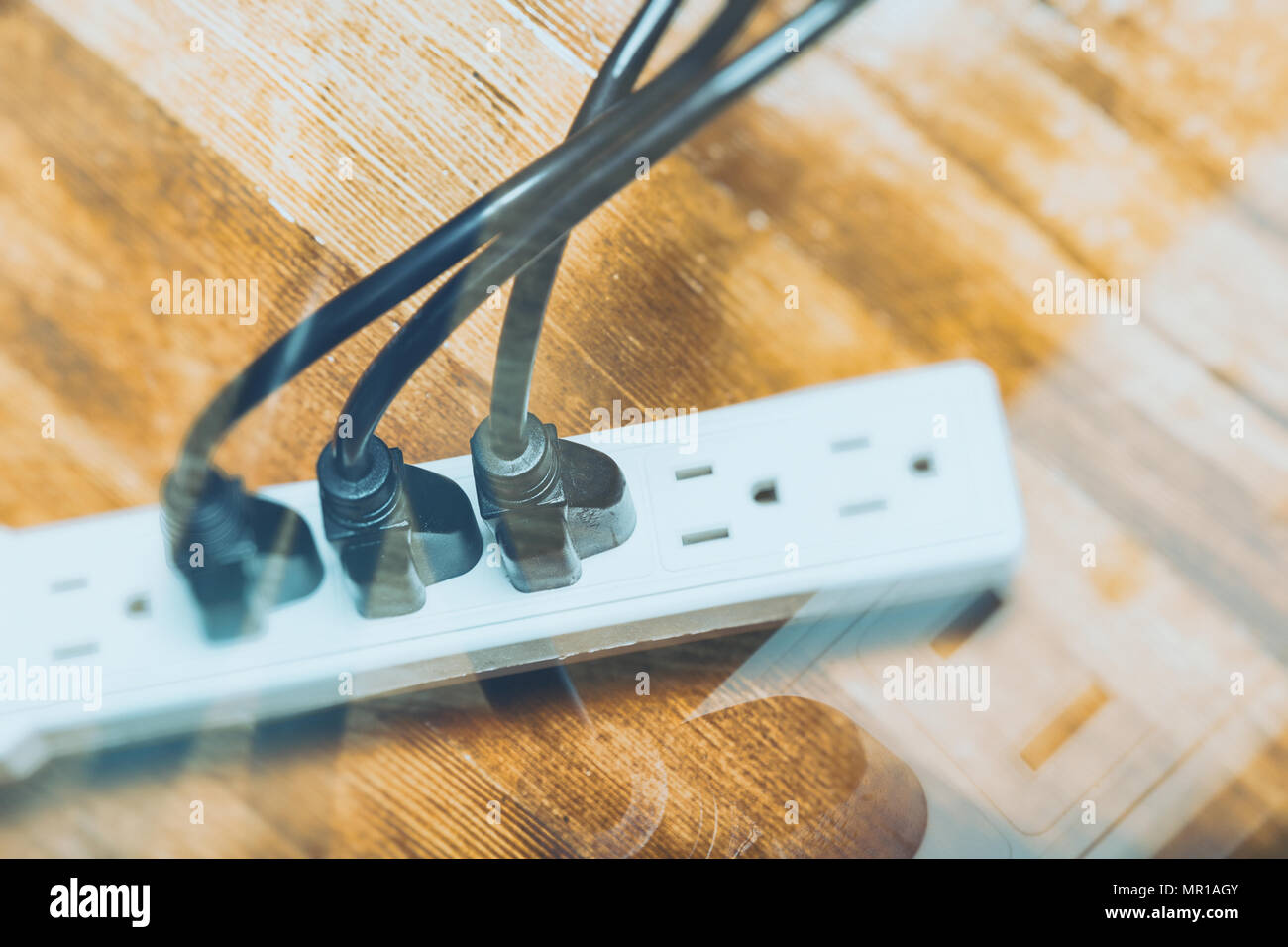electrical plugs connected to a power strip Stock Photo - Alamy