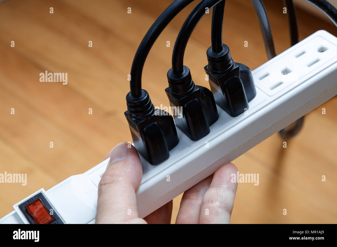electrical plugs connected to a power strip Stock Photo - Alamy