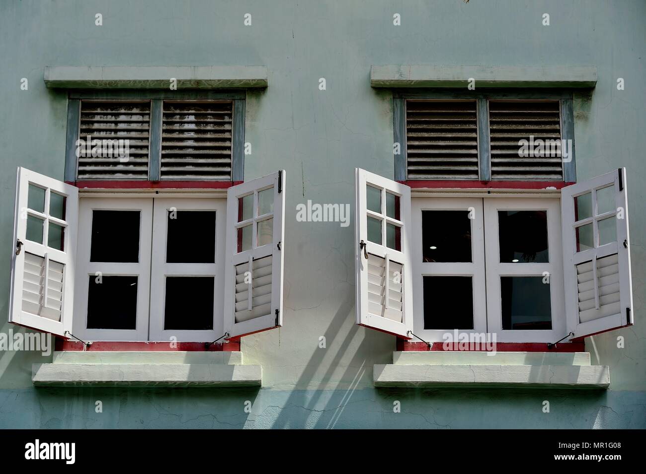 Traditional vintage Singapore shop house with antique open white wooden ...