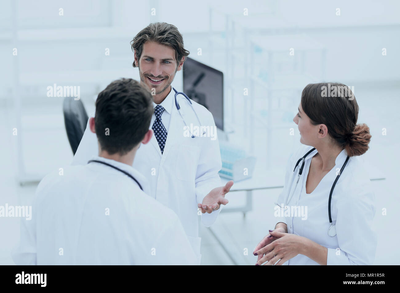 Group of doctors talking Stock Photo - Alamy