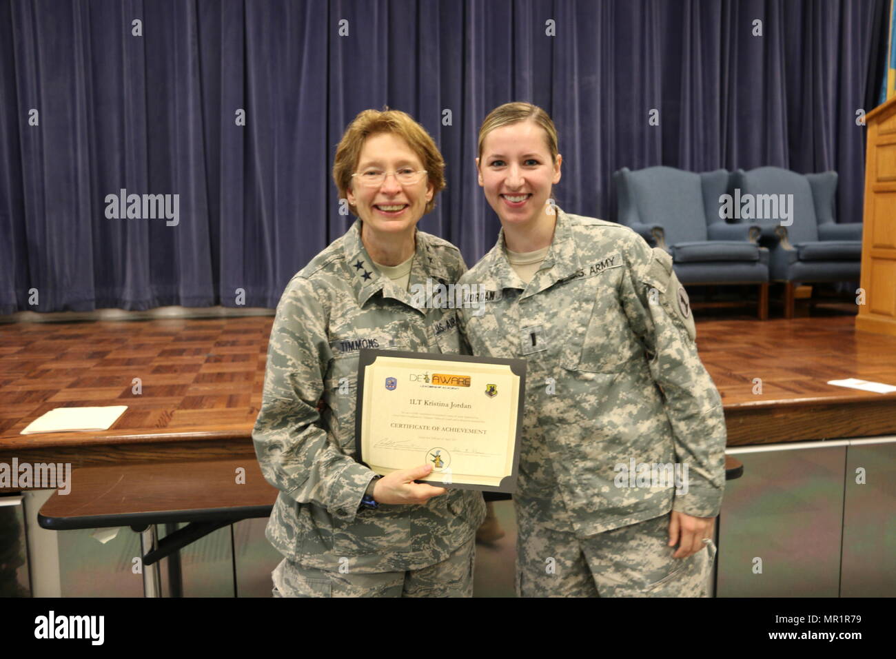 Maj. Gen. Carol Timmons presents a Certificate of Achievement to 1st Lt ...