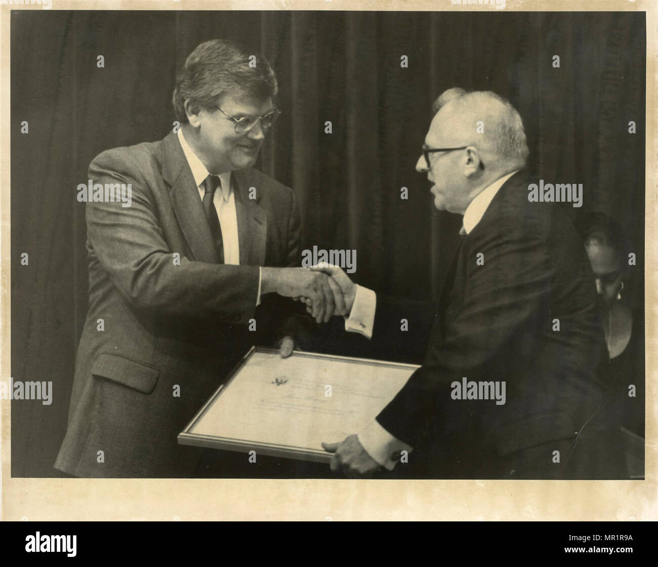 Admin. Atwood presenting general awards - Man receiving award on stage ...