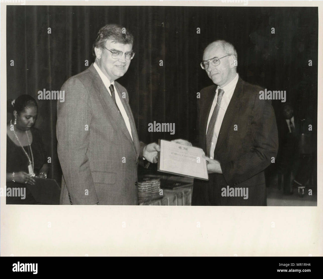 Admin. Atwood presenting general awards - Man receiving award on stage ...