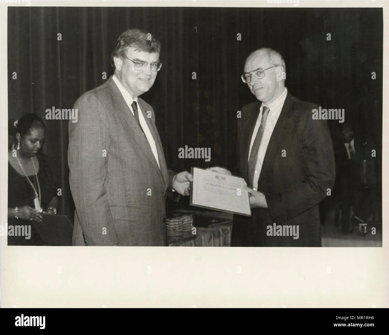 Admin. Atwood presenting general awards - Man receiving award on stage ...
