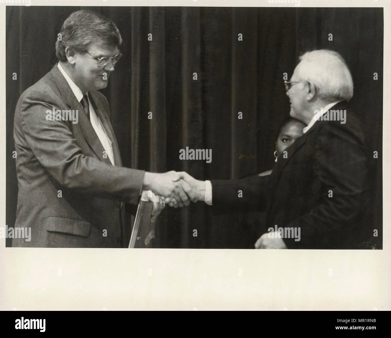 Admin. Atwood presenting general awards - Man receiving award on stage ...