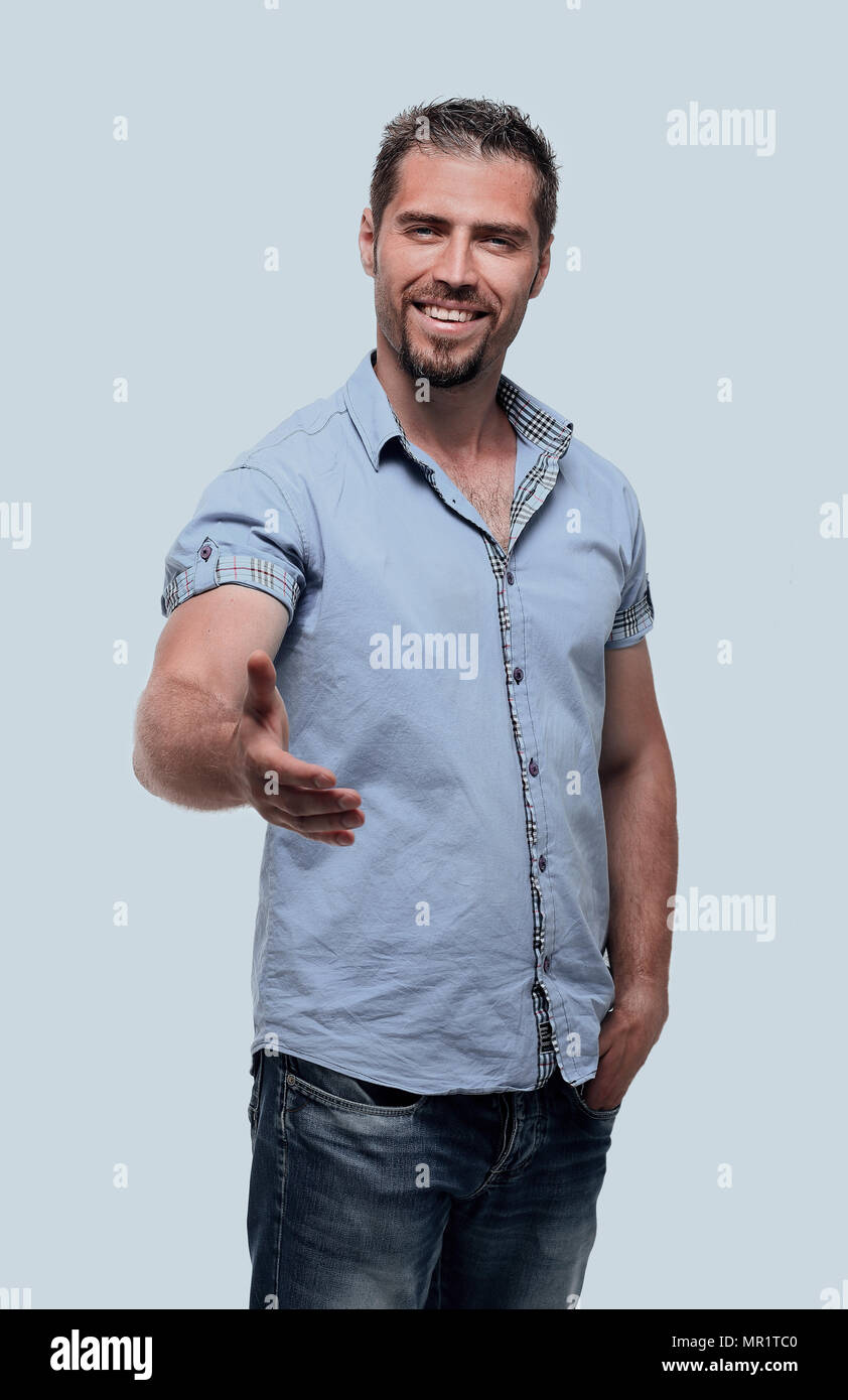 stylish young man holds out his hand for a handshake Stock Photo - Alamy
