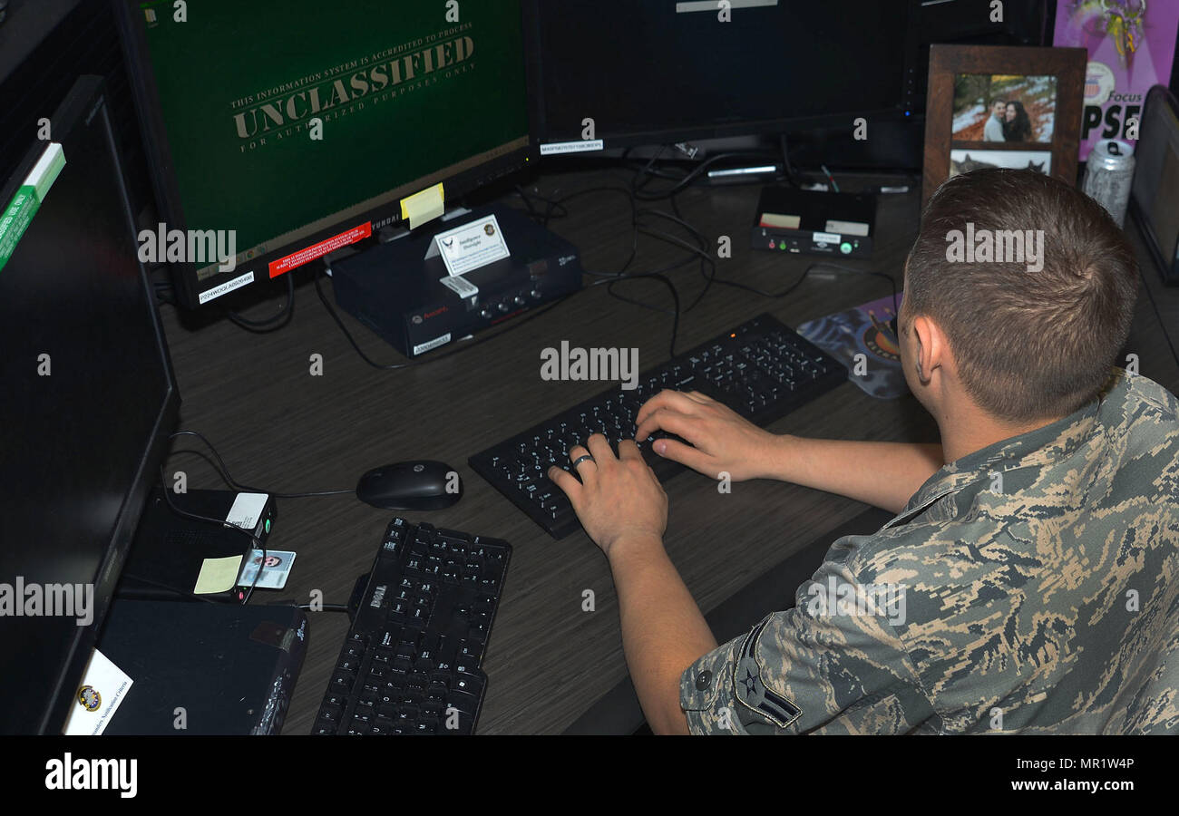 Airmen and contractors with the 35th Intelligence Squadron conduct ...