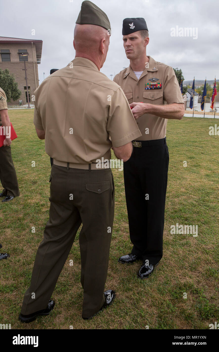 U.S. Navy Petty Officer 2nd Class Matthew Petree receives a Junior ...