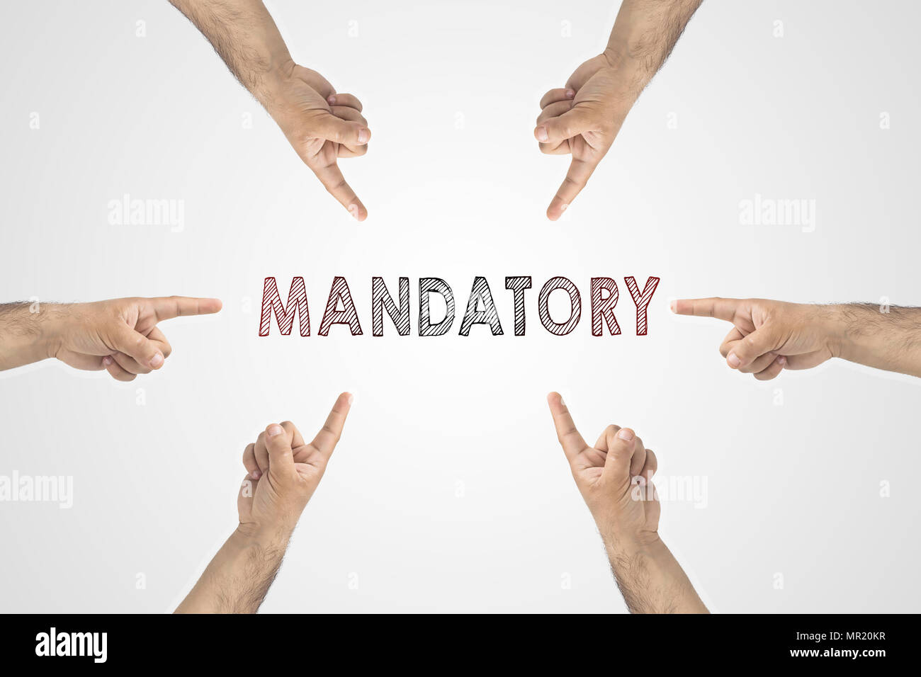 Mandatory concept. Hands around the photo showing to the inscription ...