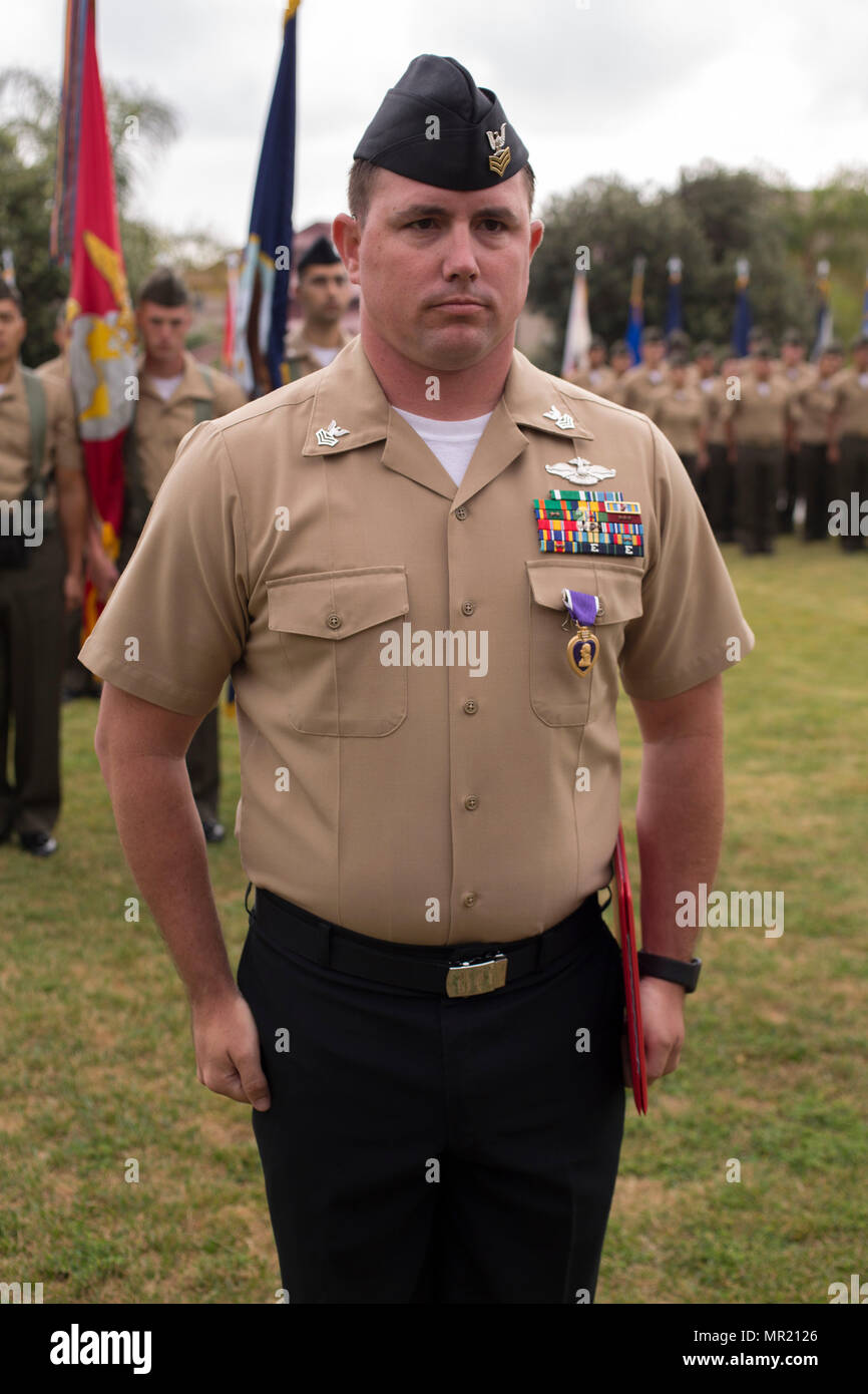U.S. Navy Petty Officer 1st Class Philip Lopez receives a Purple Heart ...