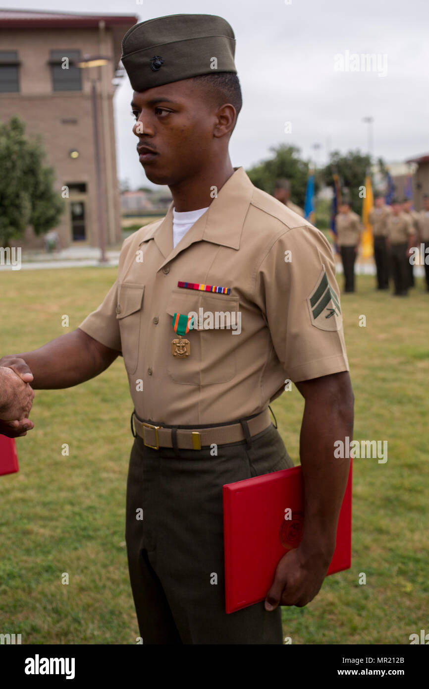 U.S. Marine Cpl. Chavon Williams receives a Navy and Marine Corps ...