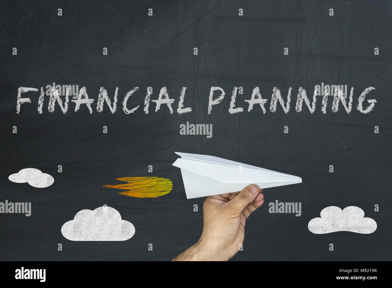 Financial planning words on blackboard. Hand holding paper plane Stock ...