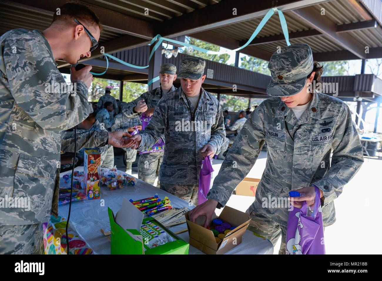 Airmen claim prizes following the 2nd Annual Easter Egg Hunt at ...