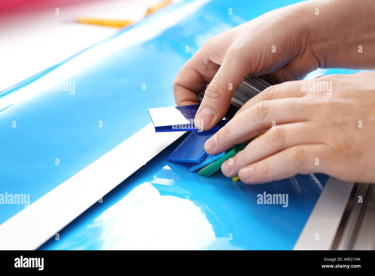 Color sampler. The designer chooses the color of the foil Stock Photo ...