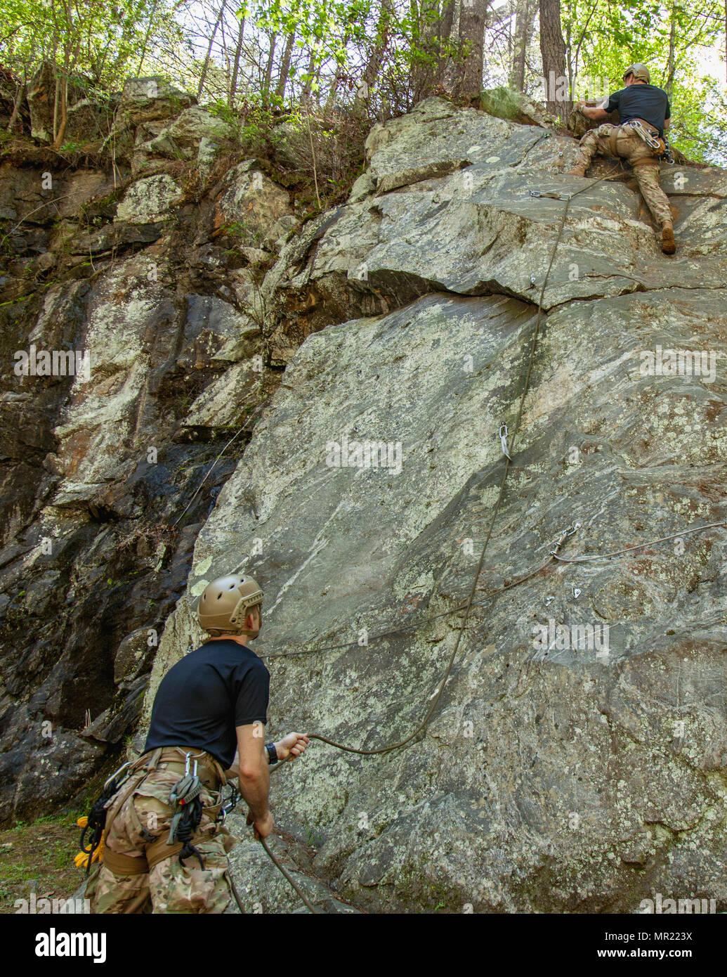 U.S. Army Ranger Staff Sgt. Randall Henrion belays U.S. Army Ranger Sgt ...