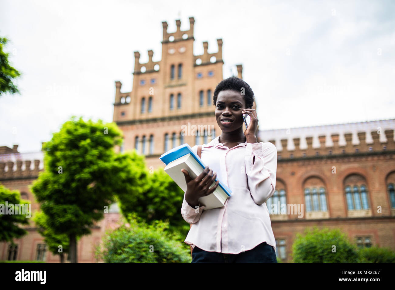 pretty african american college student making a phone call Stock Photo ...