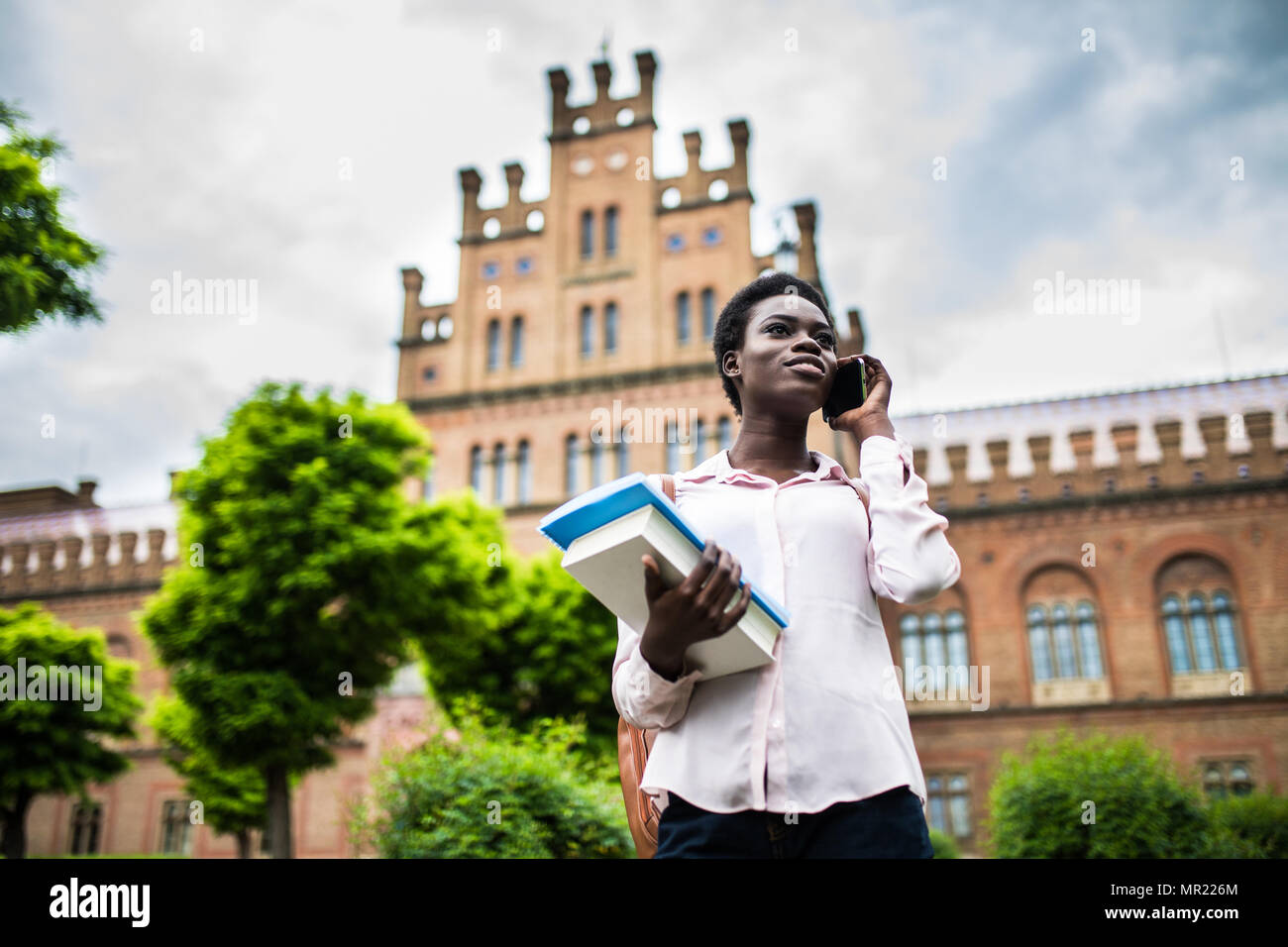 pretty african american college student making a phone call Stock Photo ...