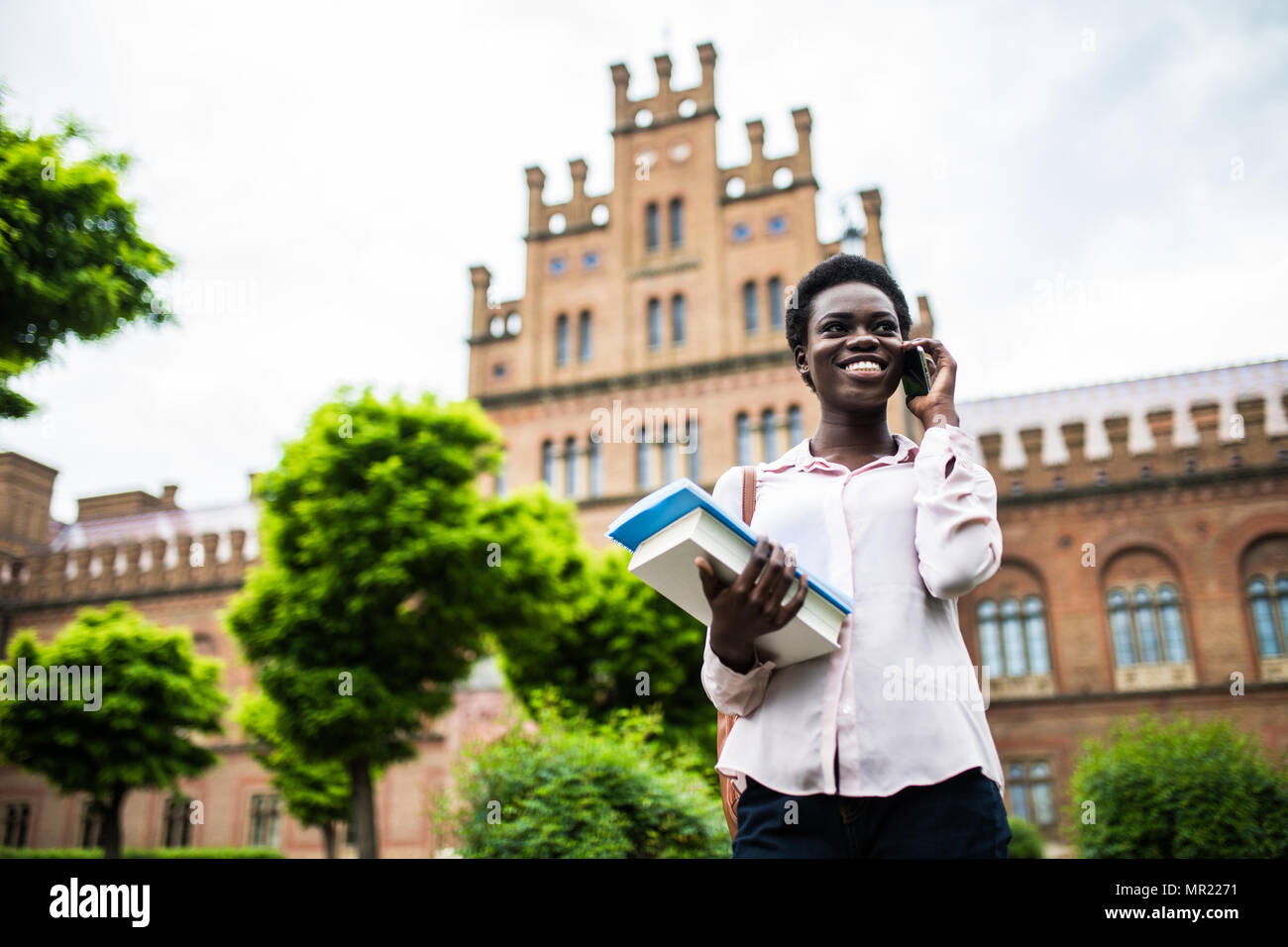 pretty african american college student making a phone call Stock Photo ...