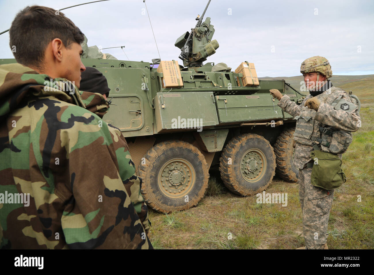 A U.S. Army Soldier from the 58th CBRN Company instructs on washing a ...