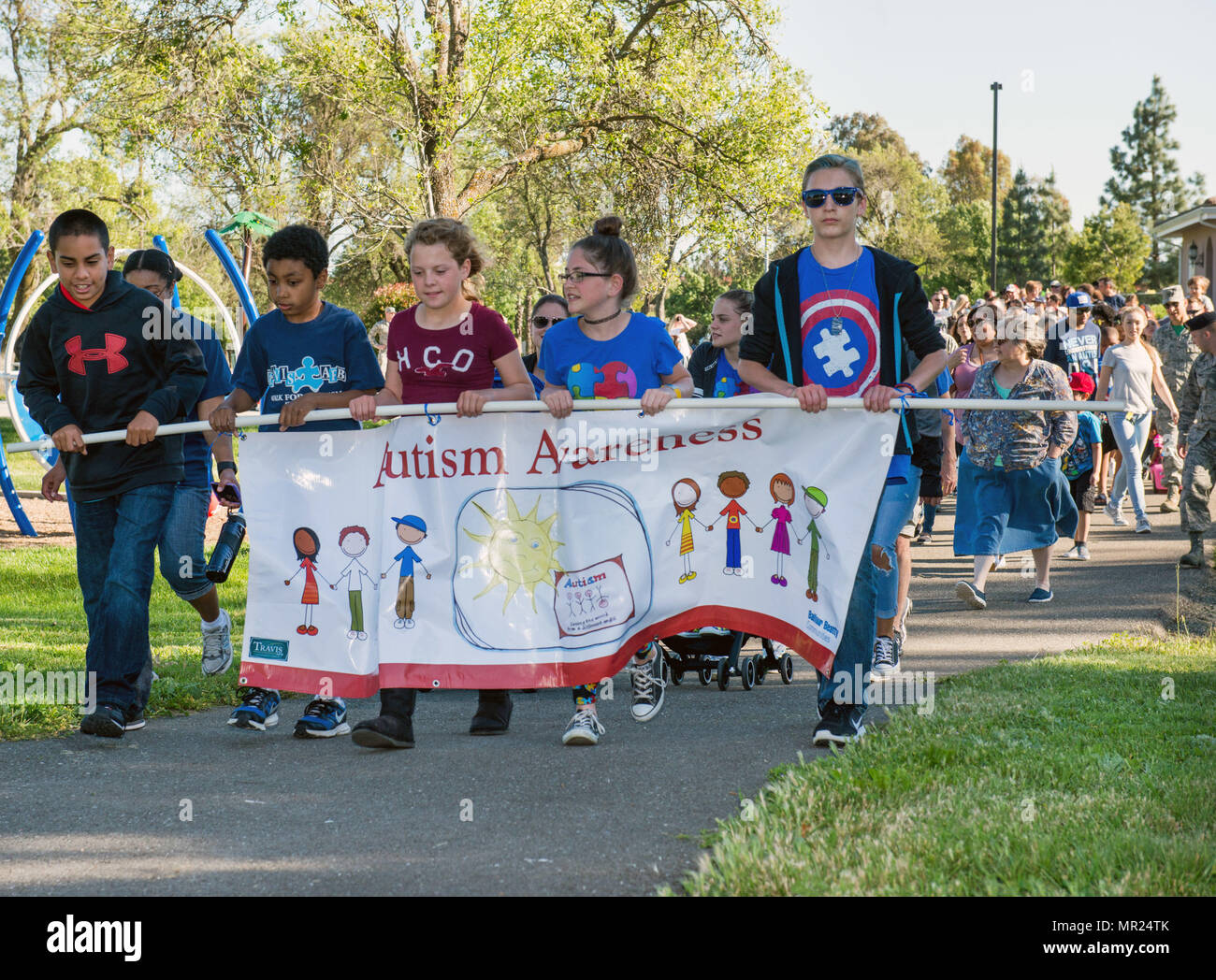 Service and family members participate in the Autism Awareness Walk at ...