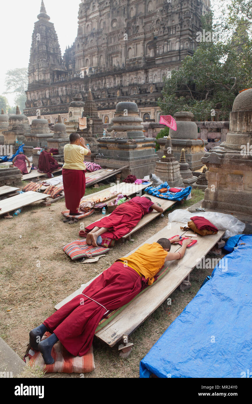 India, Bihar, Bodhgaya, Buddhist monks prostrate themselves in front of ...