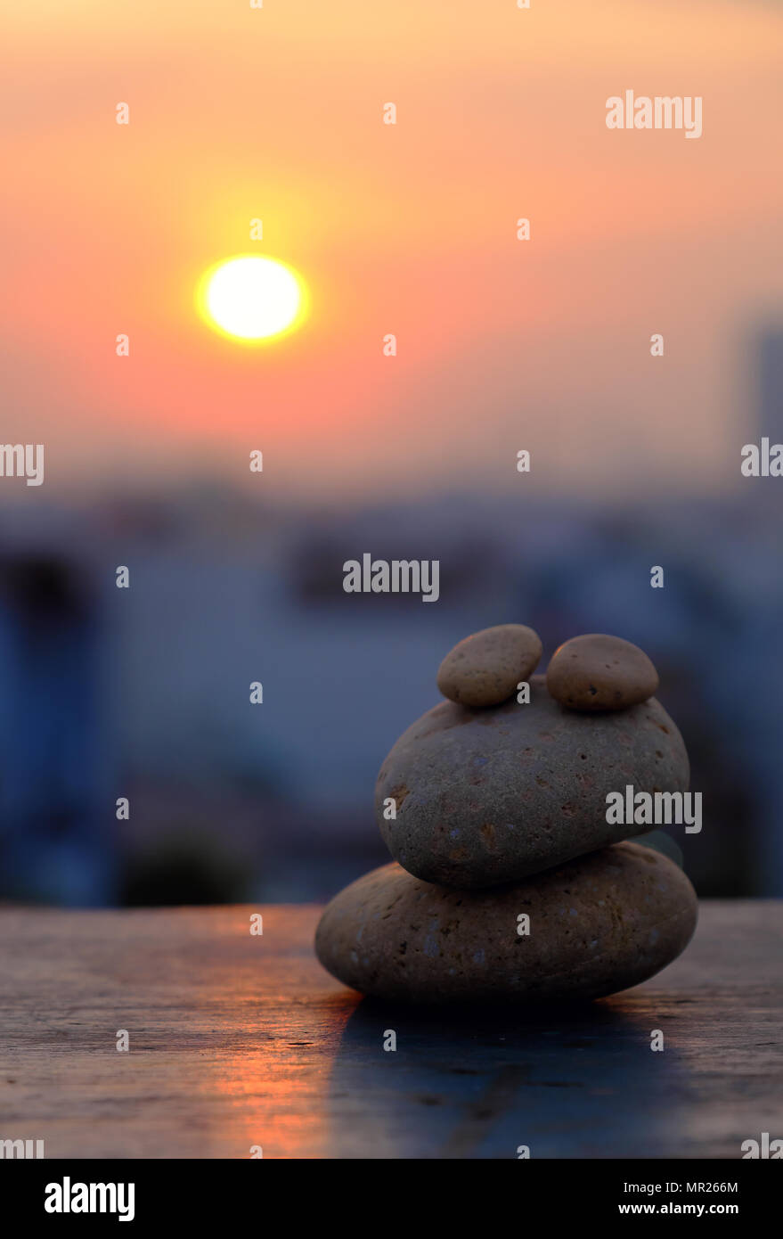 Arrangement art from boulder make amazing shape as frog on sunrise sky ...