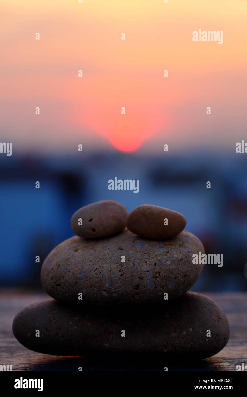 Arrangement art from boulder make amazing shape as frog on sunrise sky ...