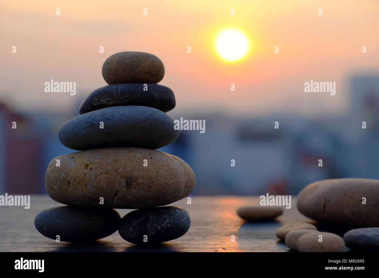 Arrangement art from boulder make amazing shape as man on sunrise sky ...