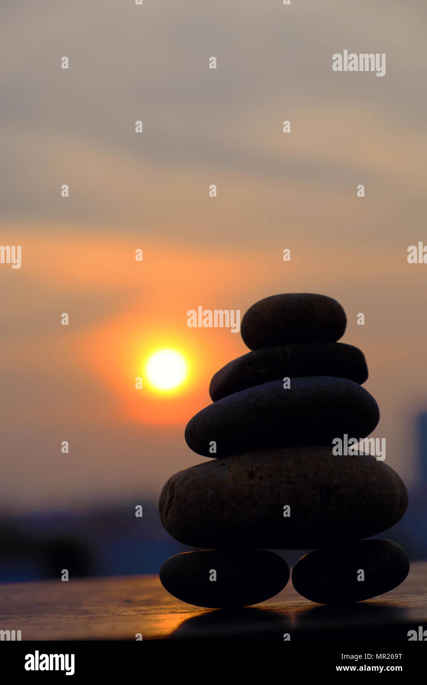 Arrangement art from boulder make amazing shape as man on sunrise sky ...
