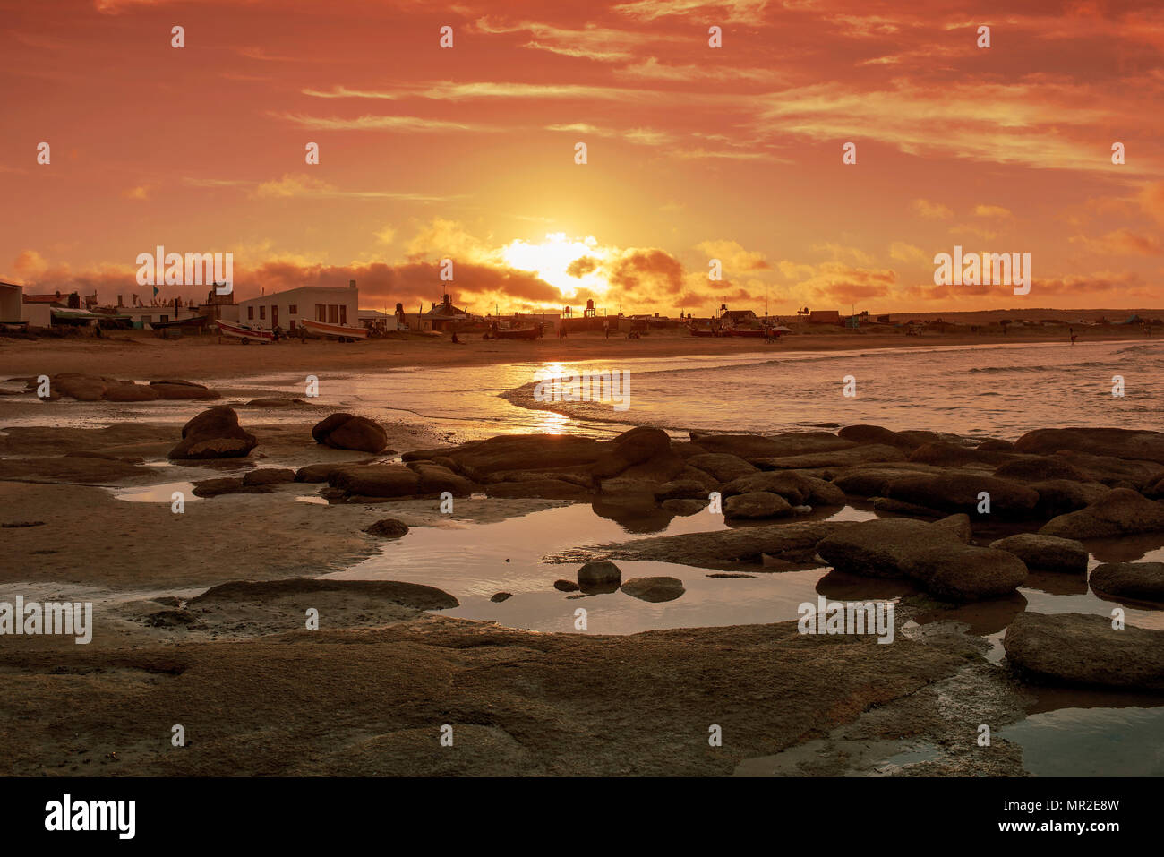The scenic beach of Cabo Polonio with its smooth rocks during sunset ...