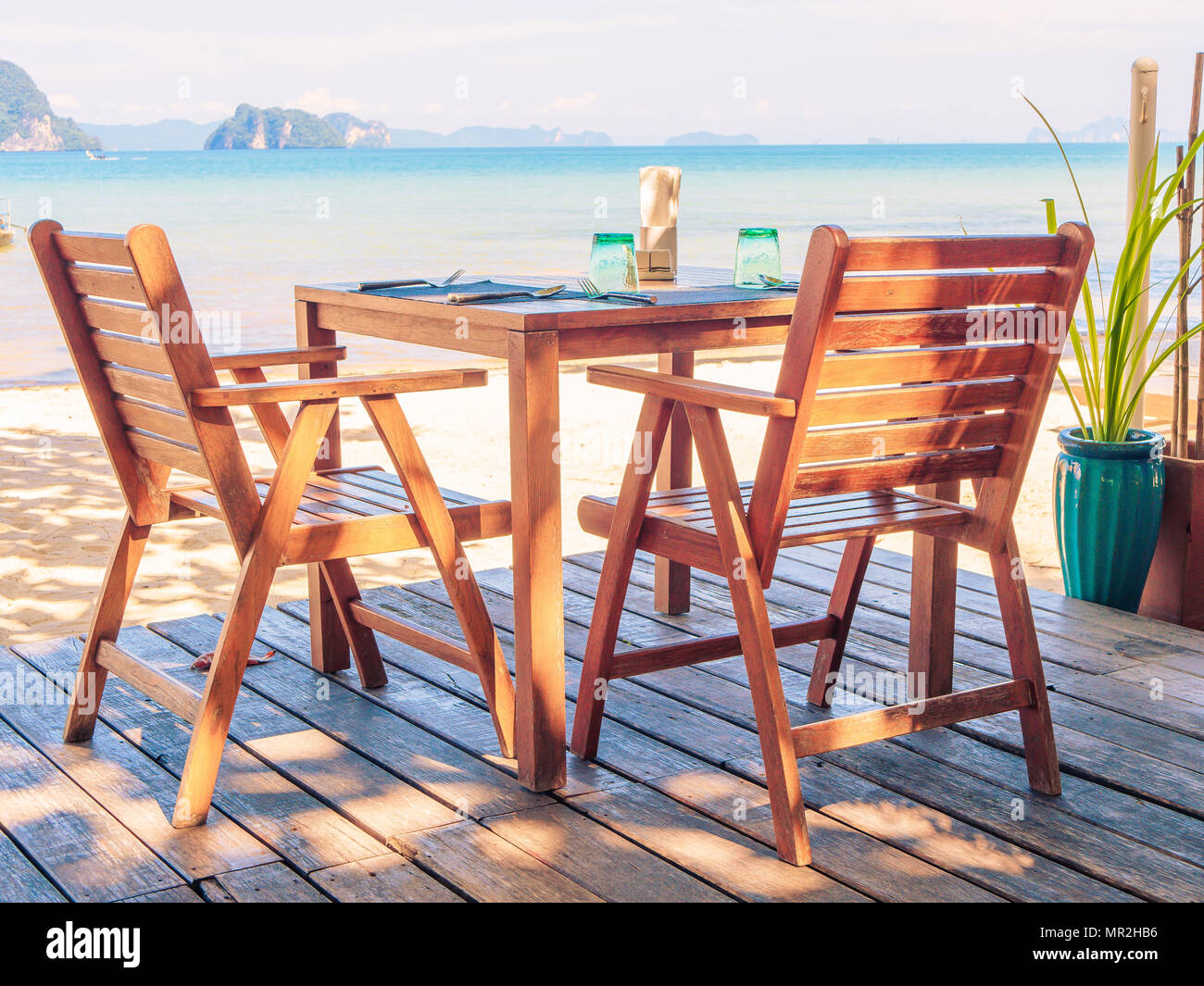 Dinner table on the beach with beautiful sea view background Stock ...