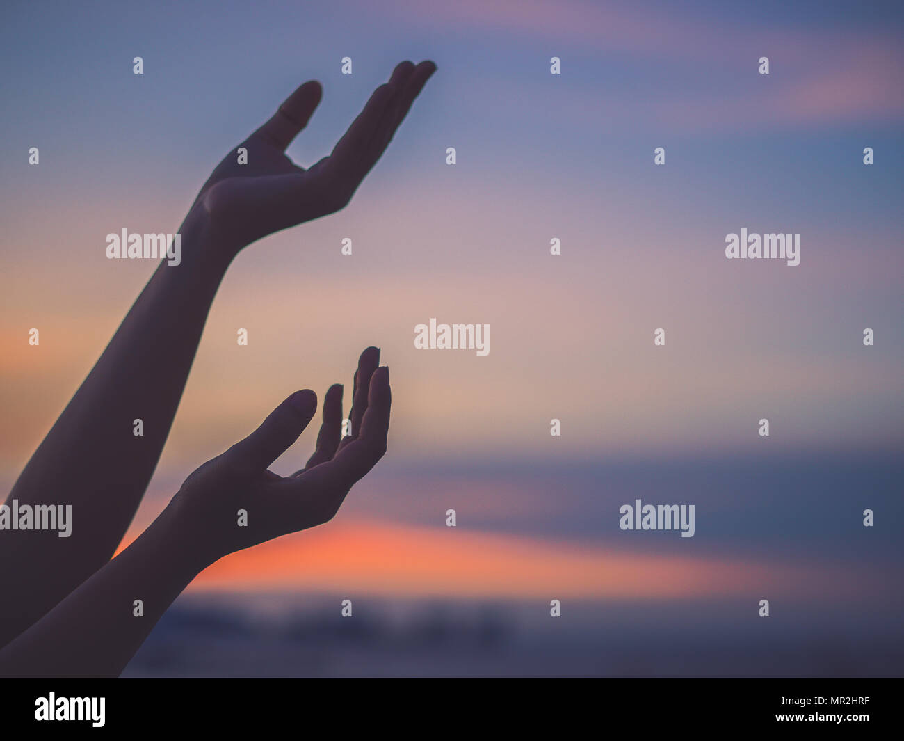 Closeup woman hands praying for blessing from god during sunset ...