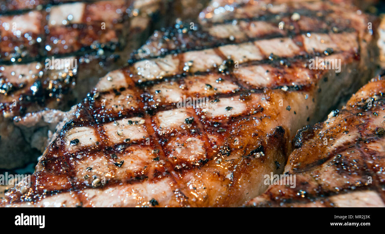 beef steak cooking on an open flame grill Stock Photo - Alamy