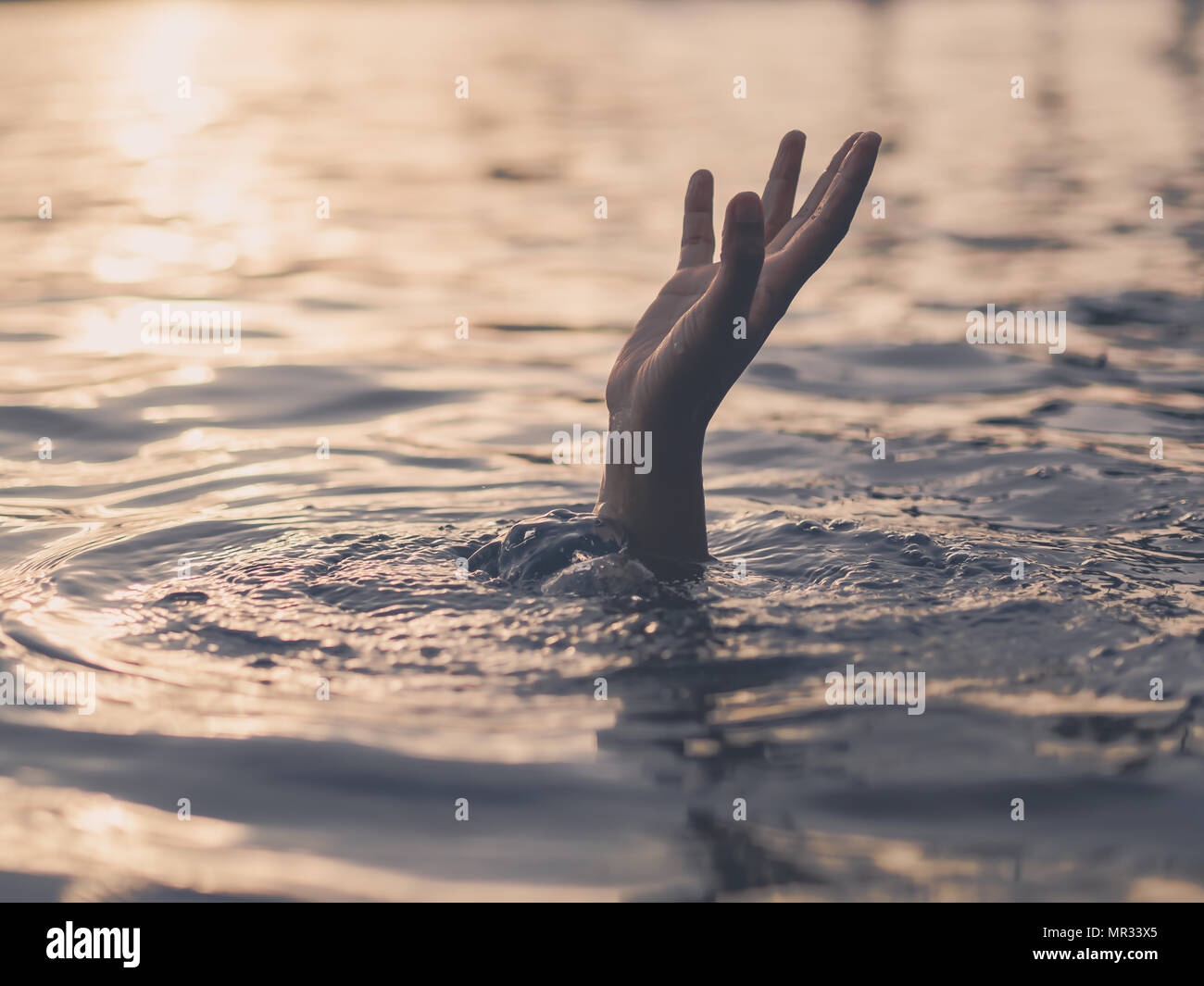 Drowning victims, hand of drowning man needing help. Failure and rescue ...