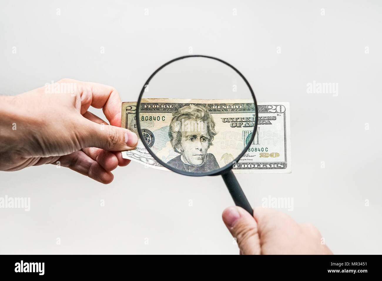 Magnifying dollar bill magnifying glass hi-res stock photography and ...
