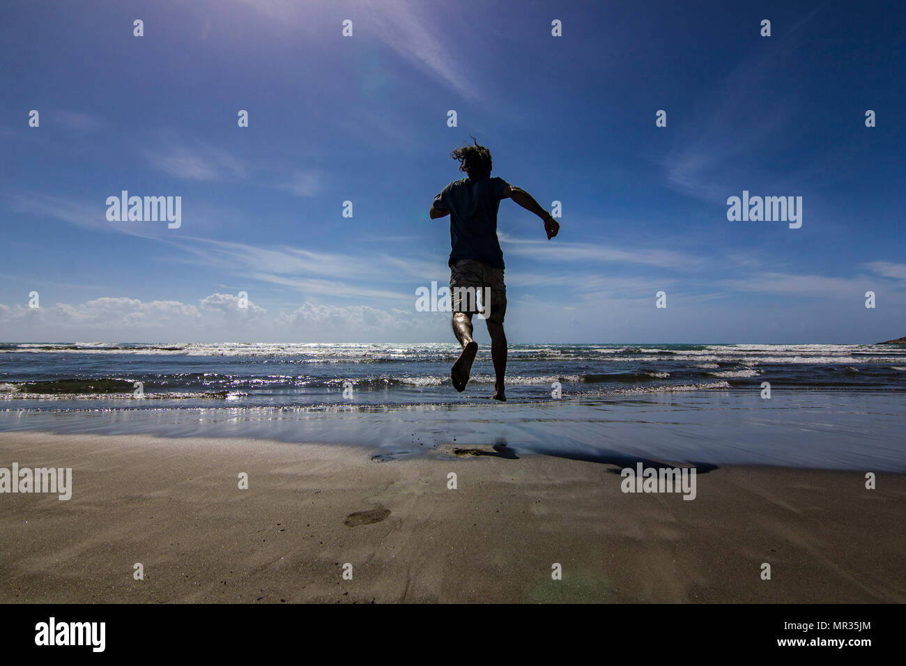 Man running from wave hi-res stock photography and images - Alamy