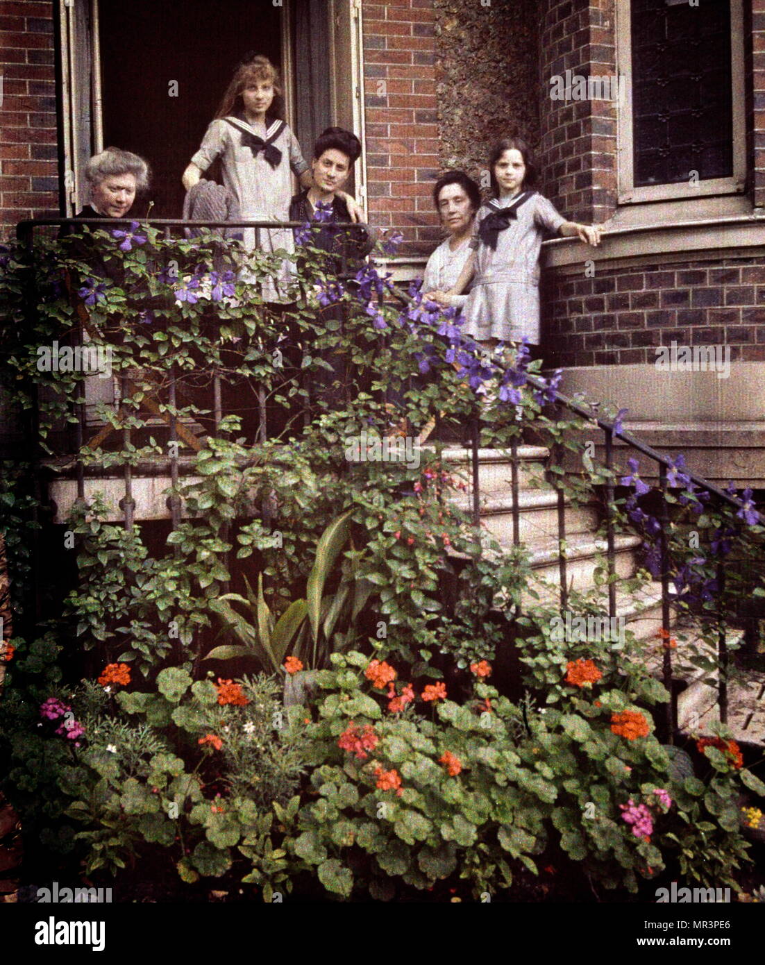 family posing on the steps of their home, France 1908. photographed in ...