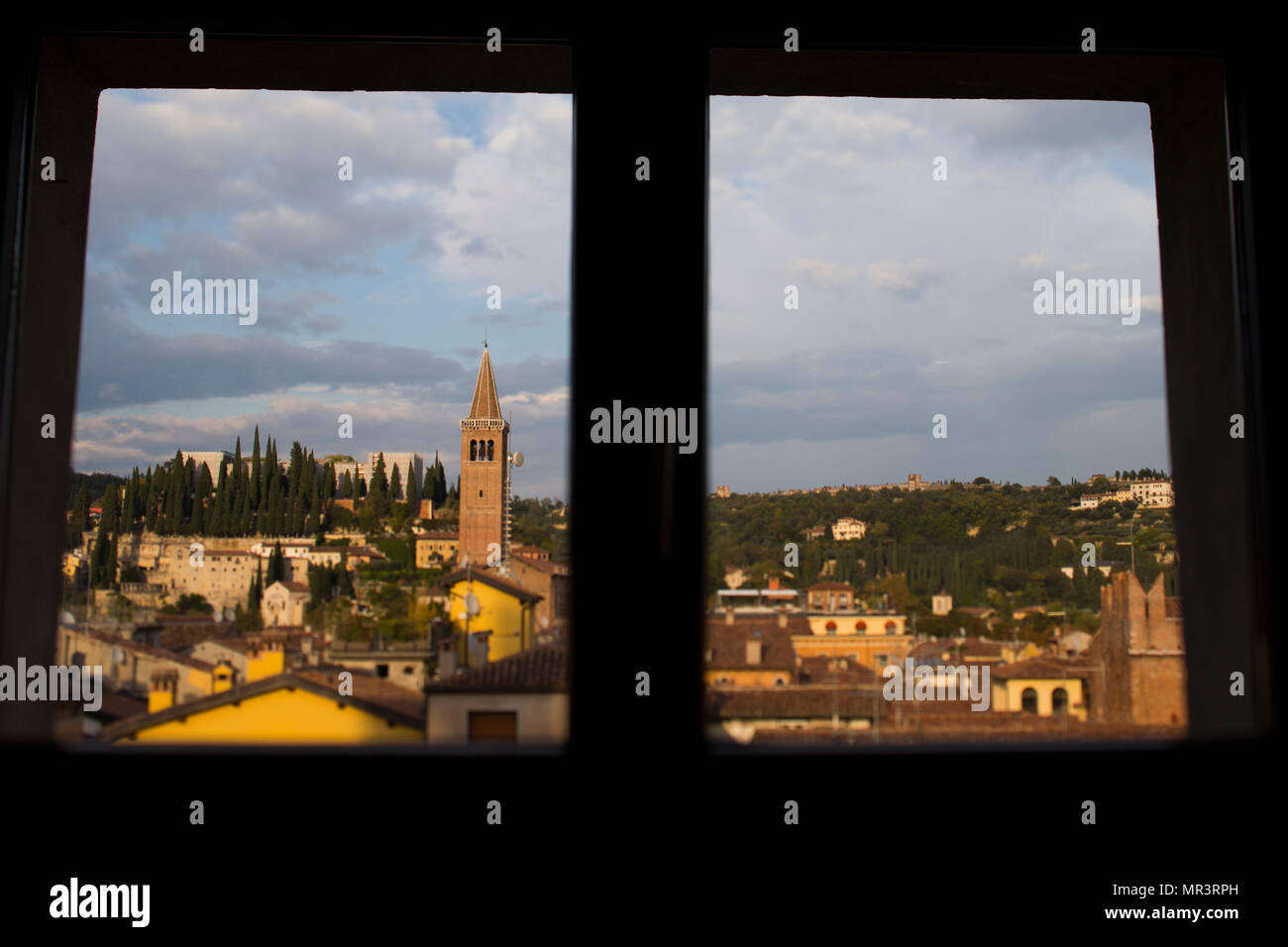 Roof top view over the Italian city of Verona with the spire of the ...