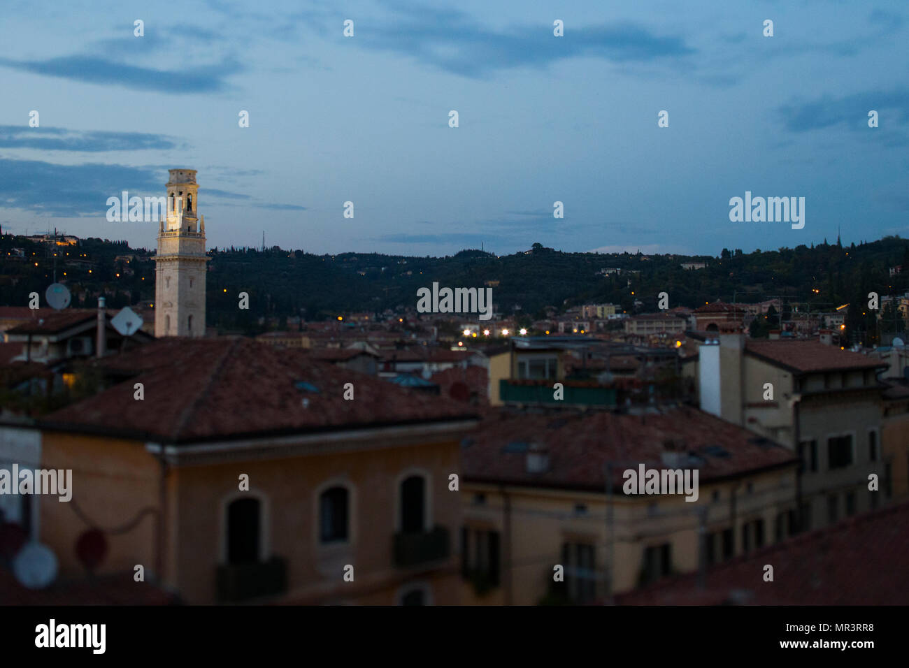 Roof top view over the Italian city of Verona with the spire of the ...