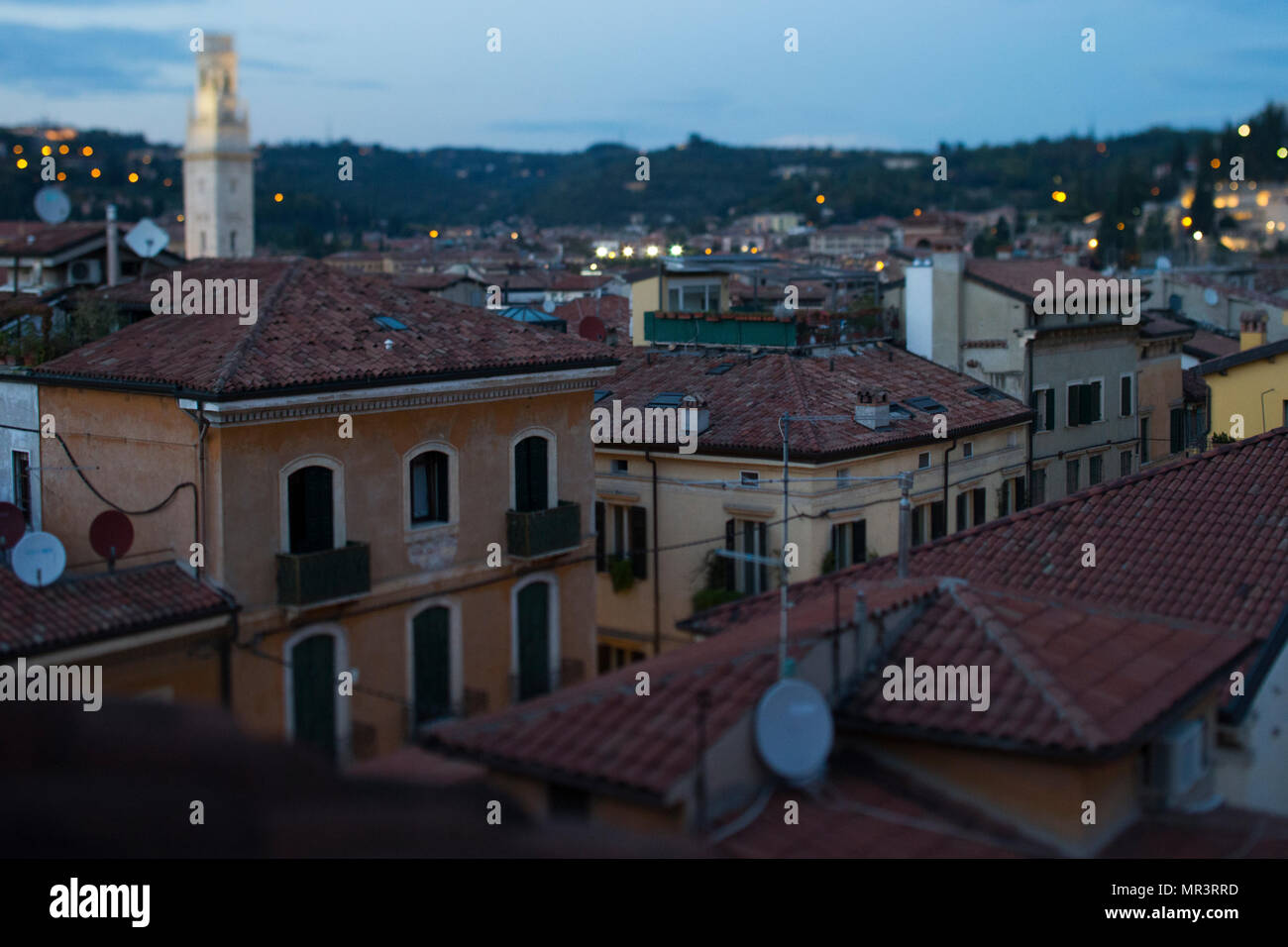 Roof top view over the Italian city of Verona with the spire of the ...