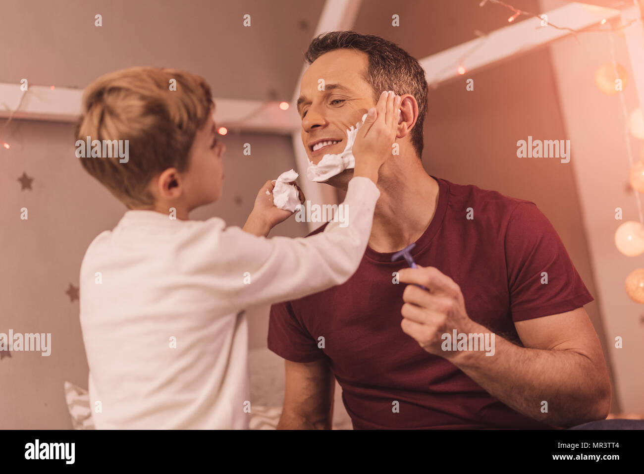 Boy helping his father hi-res stock photography and images - Alamy