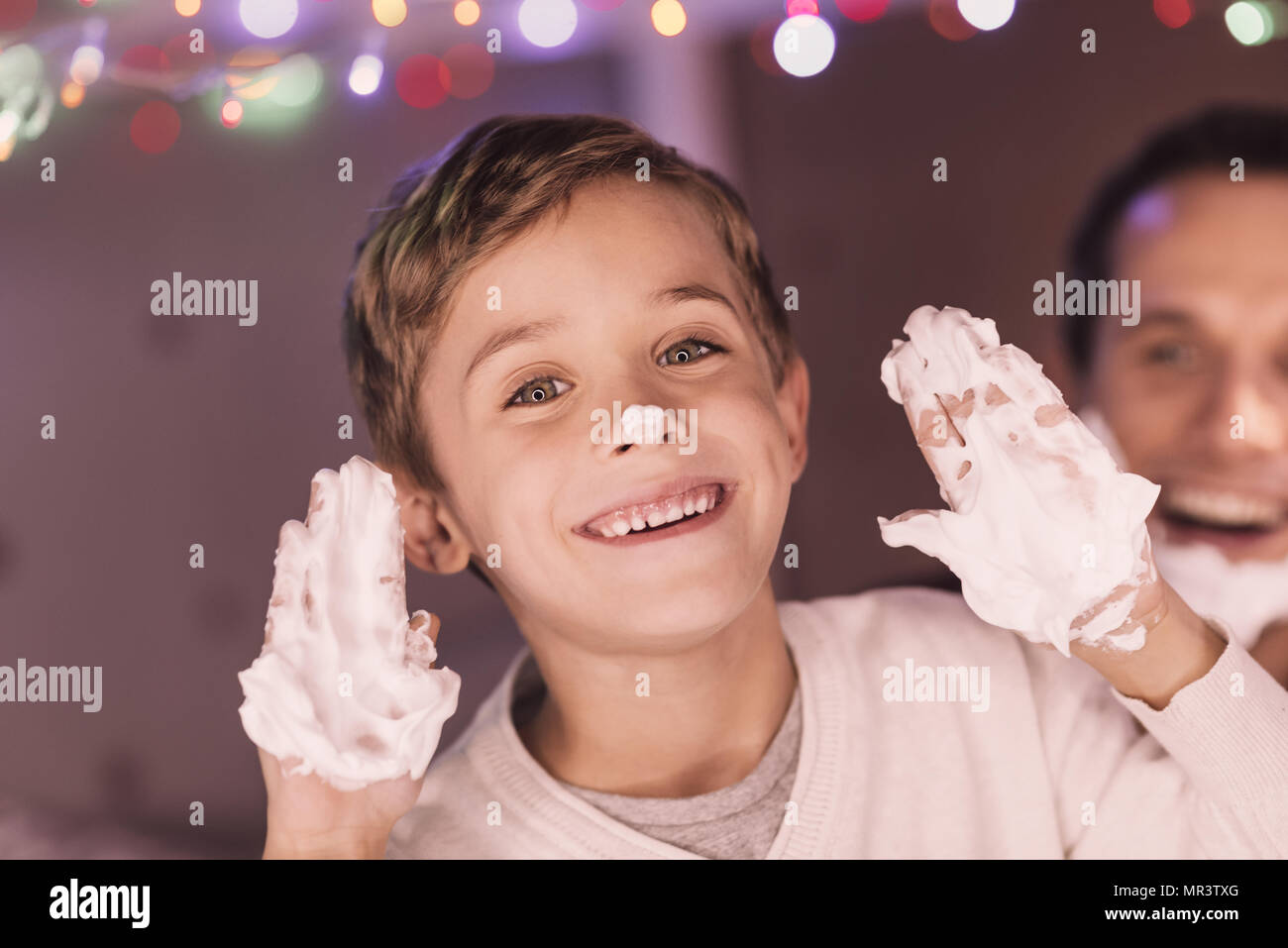 Delighted nice boy being in a playful mood Stock Photo - Alamy