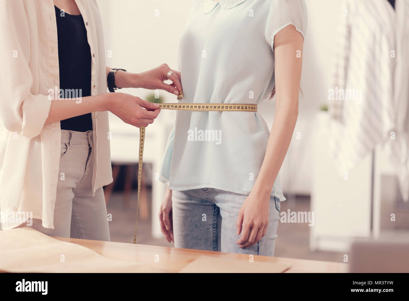 Close up of professional tailor using measuring tool Stock Photo - Alamy