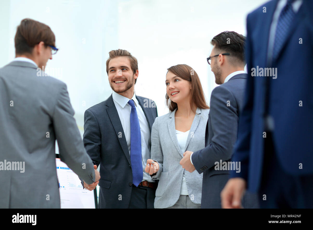 Confident young people, handshake and smile Stock Photo - Alamy
