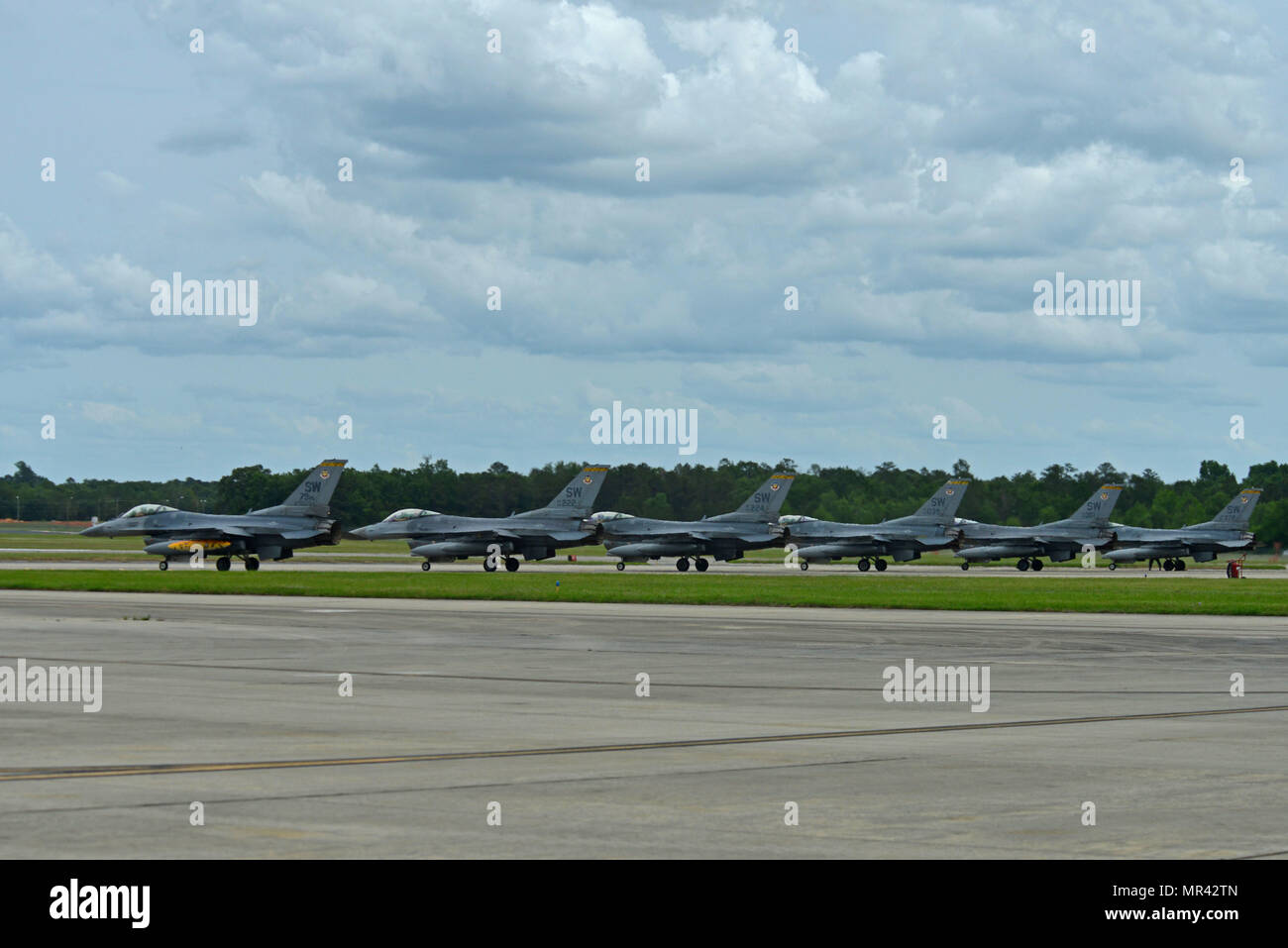 Pilots assigned to the 79th Fighter Squadron (FS) wait to taxi their F ...