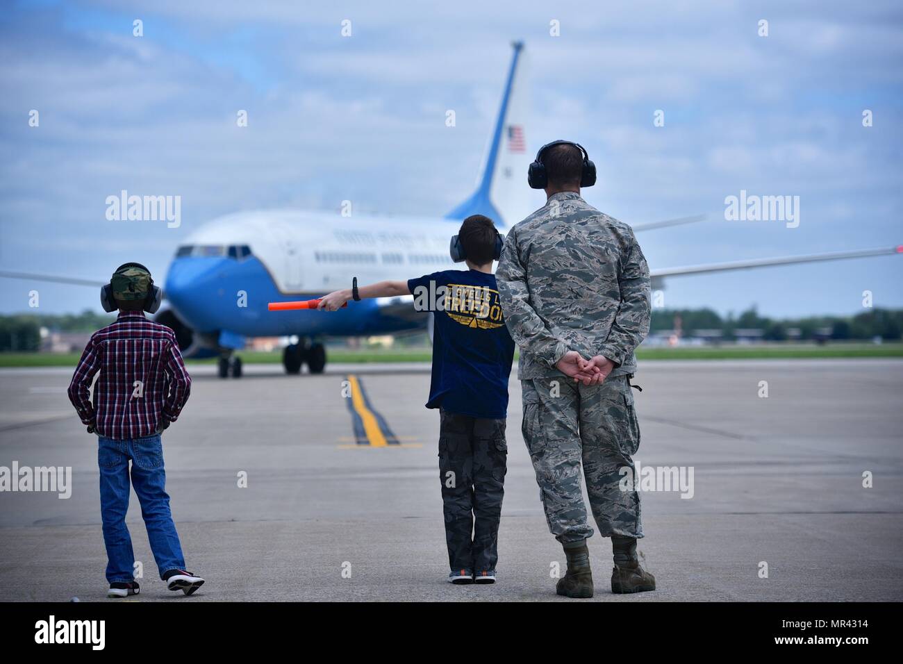 Lt. Col. Ralph "Louie" DePalma's sons help marshall him to a parking ...