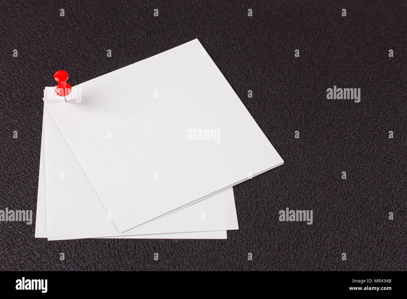 Note paper with red pin, on black. Clipping path included Stock Photo ...